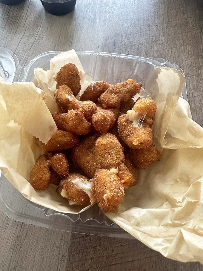 Holy cow, these cheese curds! Crispy on the outside, gooey on the inside &ndash; they're like little nuggets of dairy gold.
