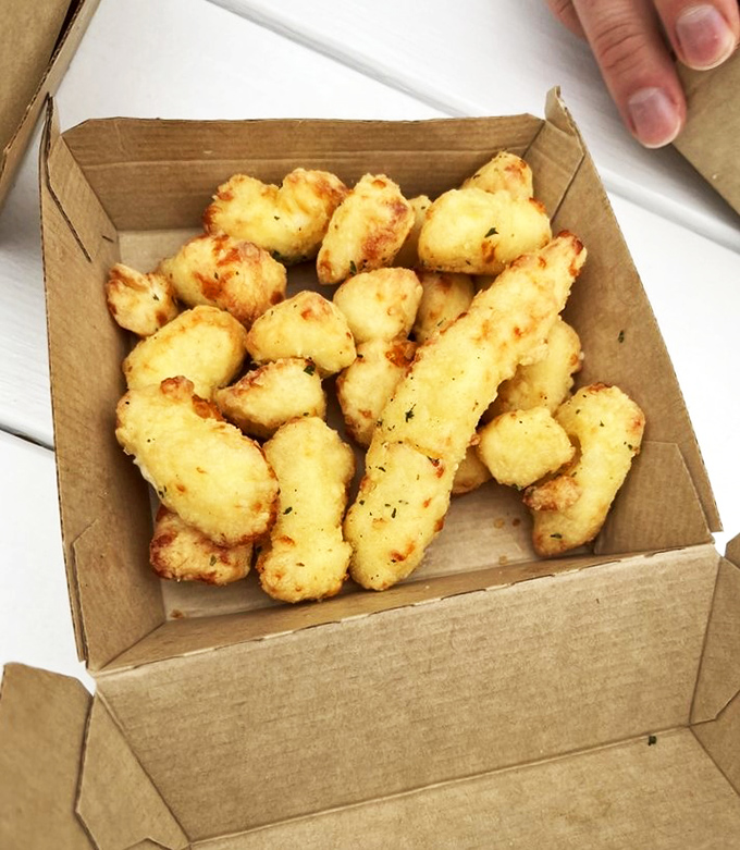 Cheese curds that squeak louder than a mouse in tap shoes! Golden, crispy, and utterly irresistible &ndash; they're the opening act to your ice cream main event.
