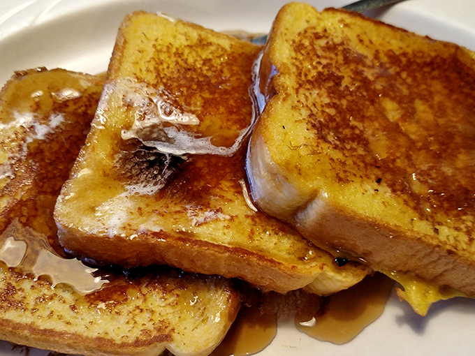 French toast that puts the 'ooh la la' in breakfast. It's so golden and inviting, you'll want to tuck yourself in for a syrupy nap.