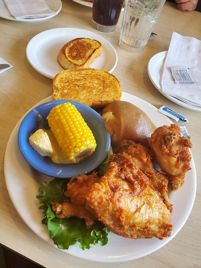 Behold the star of the show - fried chicken that could make Colonel Sanders weep with joy. Paired with corn on the cob, it's a plate of pure comfort.