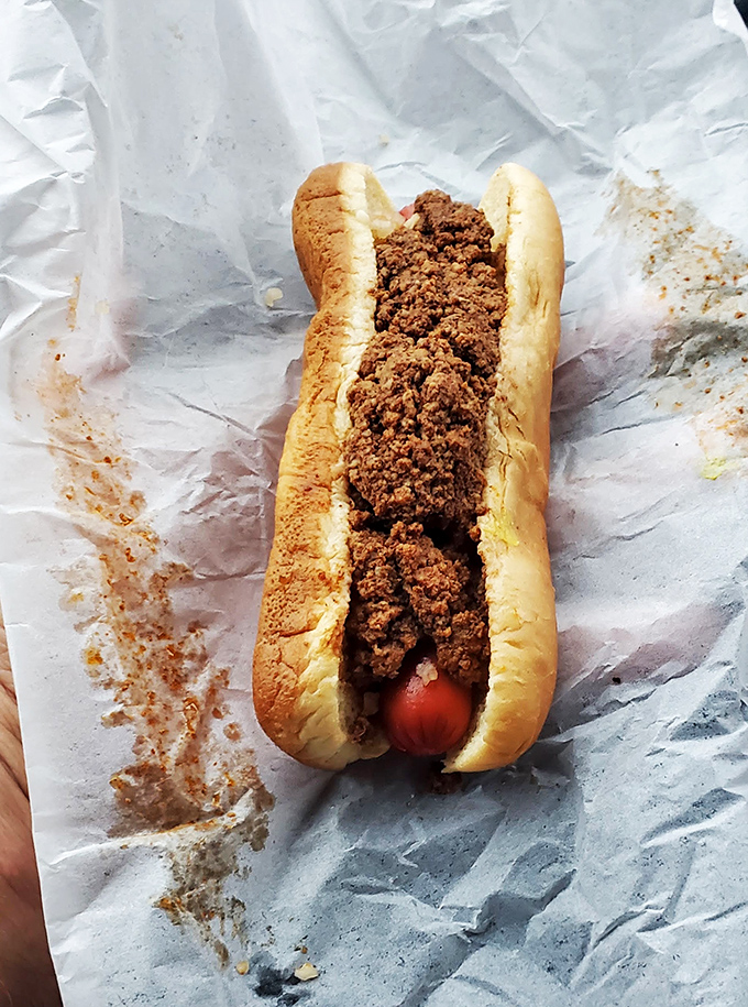 Plot twist! The Donut King's chili dog proves that even royalty can appreciate a good commoner's meal now and then.