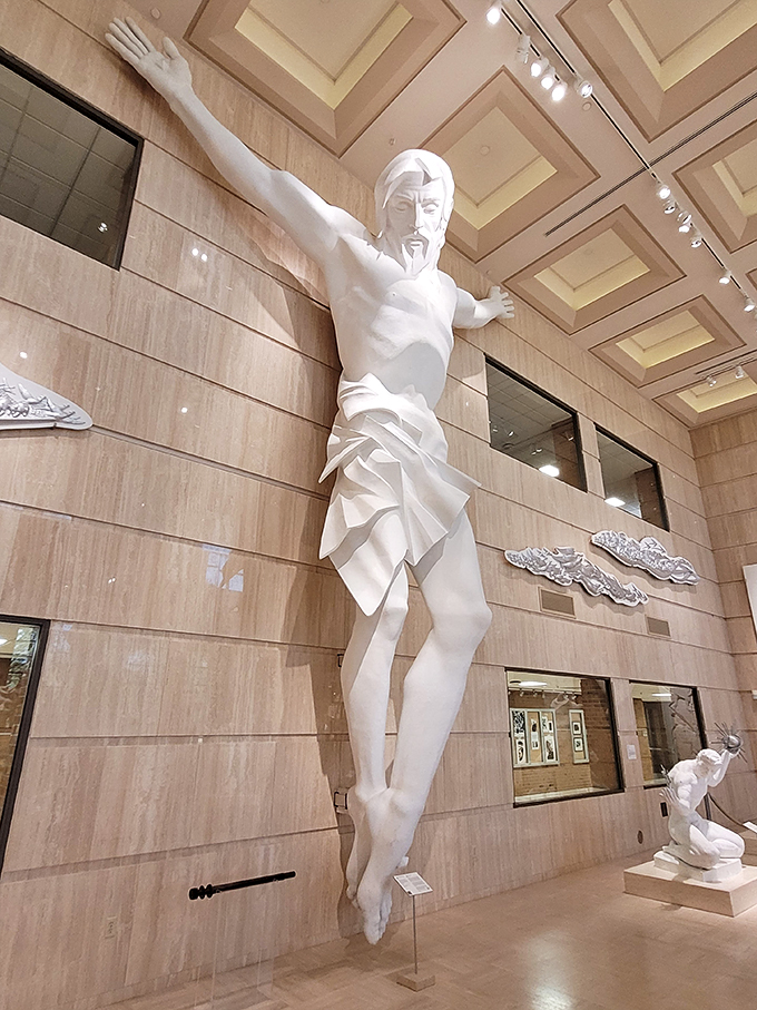 Reaching for the heavens or just really excited? This towering figure brings new meaning to the phrase "raise the roof."