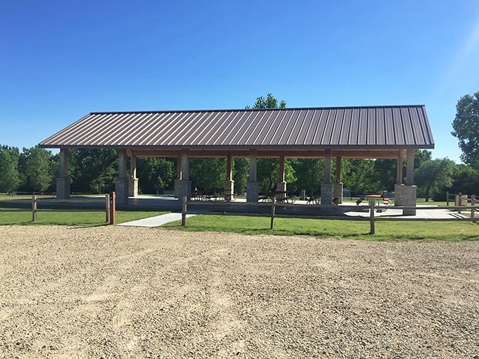 This lakeside shelter is the Swiss Army knife of picnic spots &ndash; part shade provider, part gathering place, and 100% perfect for those "I could stay here forever" moments.