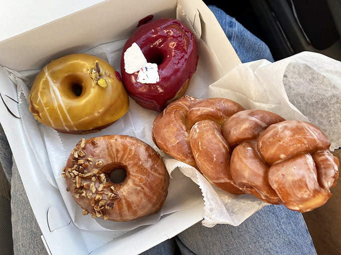 A box of joy that puts Pandora's to shame. These glazed wonders are proof that not all heroes wear capes &ndash; some wear sugar coats.