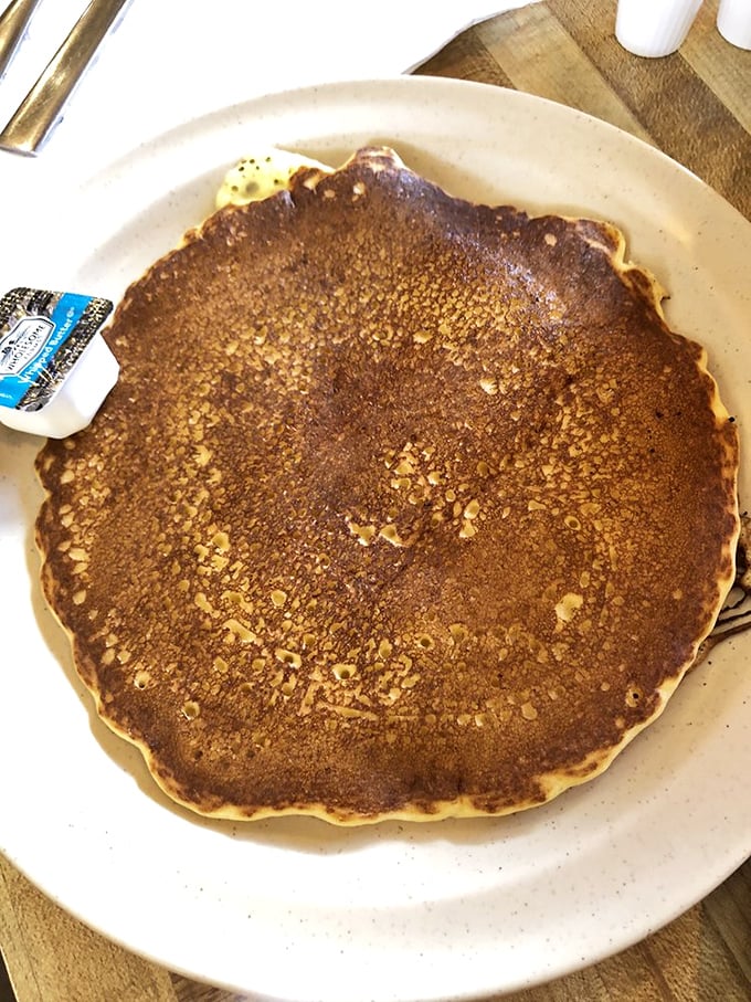 Pancake or frisbee? This golden disc of deliciousness is large enough to double as a hubcap, but far too tasty to waste on your car.