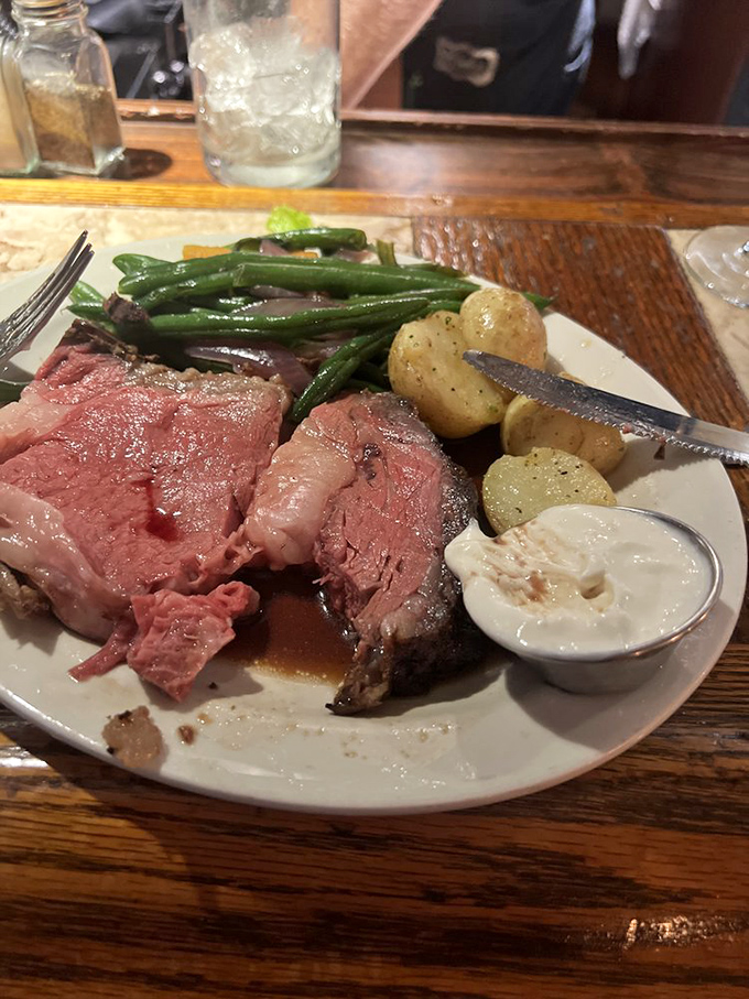 Prime rib perfection: where "well done" is a compliment, not a cooking instruction. This plate is a carnivore's dream come true.