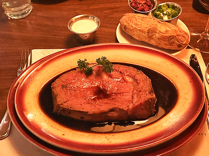 The prime rib has arrived, and it's ready for its close-up! This juicy masterpiece could make even a vegetarian weak in the knees.