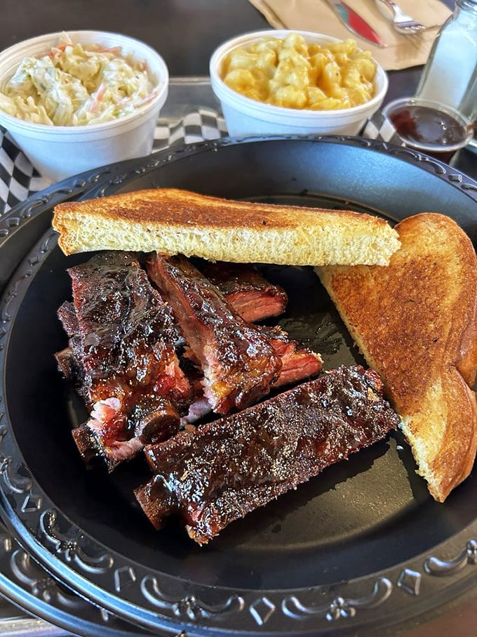 The holy trinity of BBQ: ribs, mac and cheese, and Texas toast. It's like a hug for your taste buds, with a side of Southern comfort.