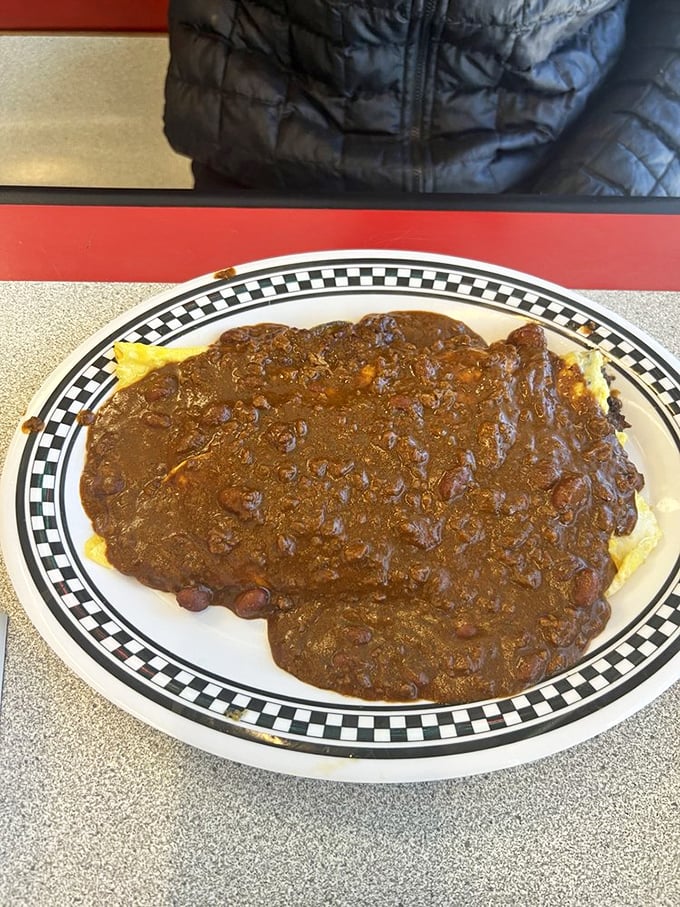 Holy cow! This chili-smothered behemoth isn't just a meal; it's a dare. Tackle it if you dare, but don't forget to Instagram first!