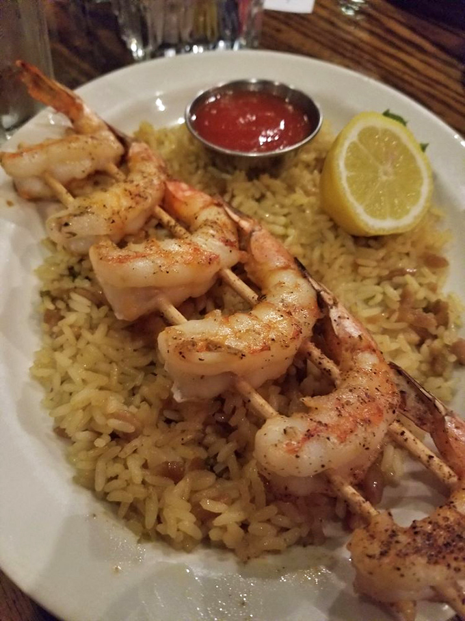 Surf meets turf in a delicious dance. These plump shrimp are ready to tango with your taste buds, nestled on a bed of savory rice.