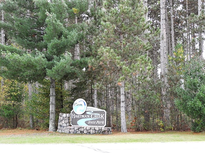 Welcome to Hartman Creek, where adventure begins! This sign marks the gateway to a world of outdoor wonders.