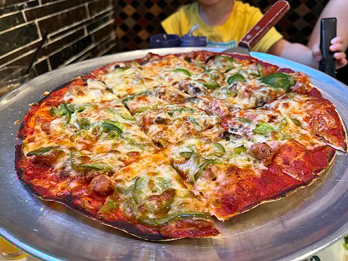 Thin crust perfection that would make even New Yorkers tip their caps. This tavern-style pizza is crispy, cheesy, and ready for its close-up.