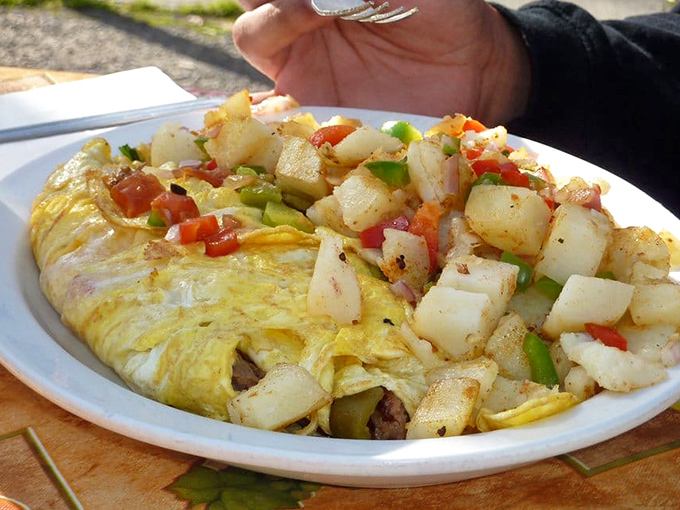 The "works" omelette lives up to its name. It's not just breakfast; it's an edible Tetris game of flavors, with each bite a winning combination.
