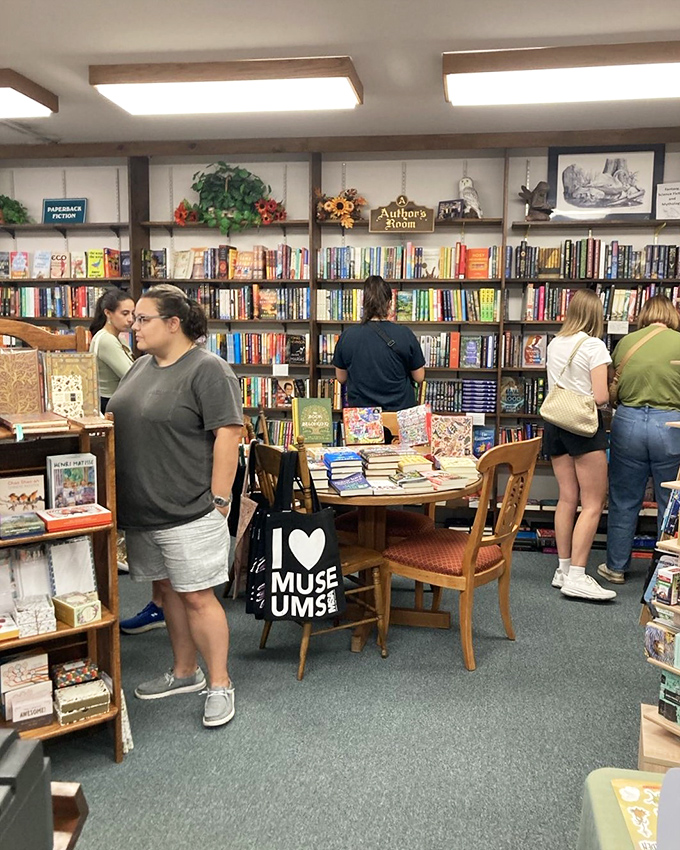 Browsers in their natural habitat! Like bees to literary honey, readers flock to The Bookshelf's sweet selection of stories.
