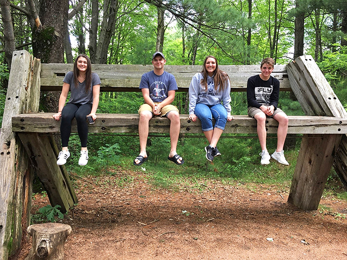 Art brings people together, and this bench sculpture proves it. It's like a sitcom set waiting for its cast of characters.