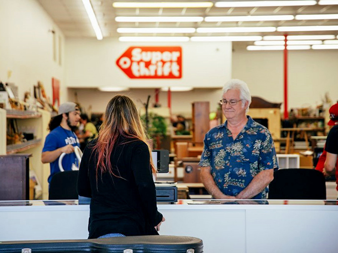Thrift store sommeliers at work! These friendly faces are the unsung heroes of your next great find.