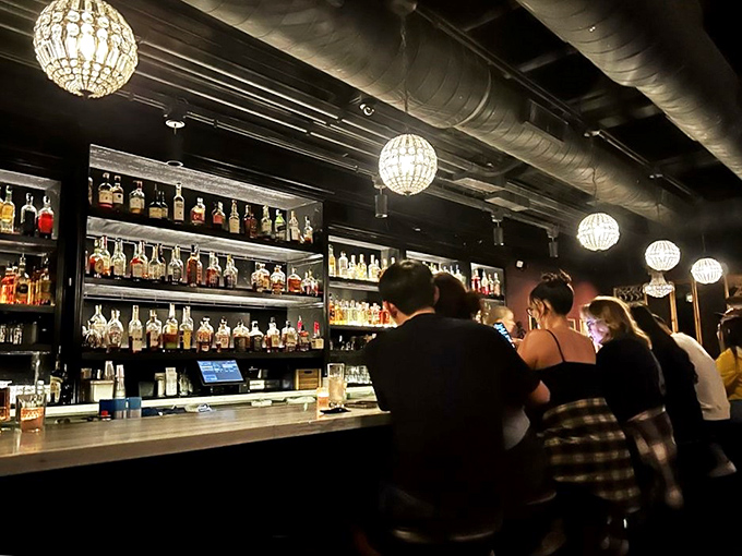 Cheers to new friends and old spirits! The bar's buzzing energy could power a small city &ndash; or at least fuel a night of unforgettable stories.