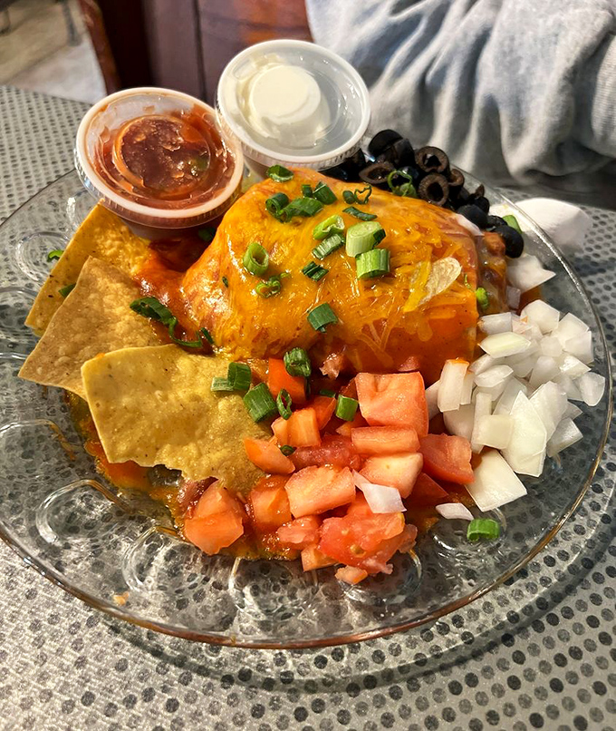 Holy guacamole! This "wet burrito" is swimming in a sea of cheesy goodness. It's like a flavor fiesta wrapped in a tortilla blanket.