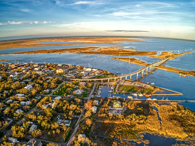 Apalachicola: Where the river meets the sea. This aerial view showcases the town's perfect blend of coastal and riverine beauty.