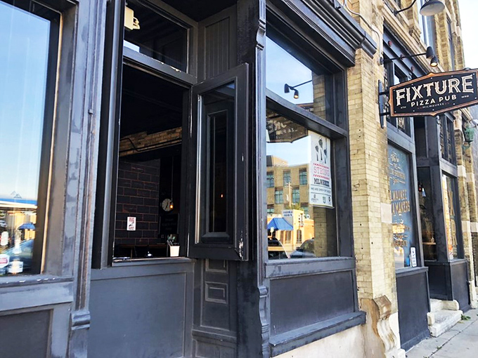 Windows to pizza paradise! Fixture's inviting exterior is just a teaser for the flavor fiesta waiting inside. It's like pizza's red carpet entrance.