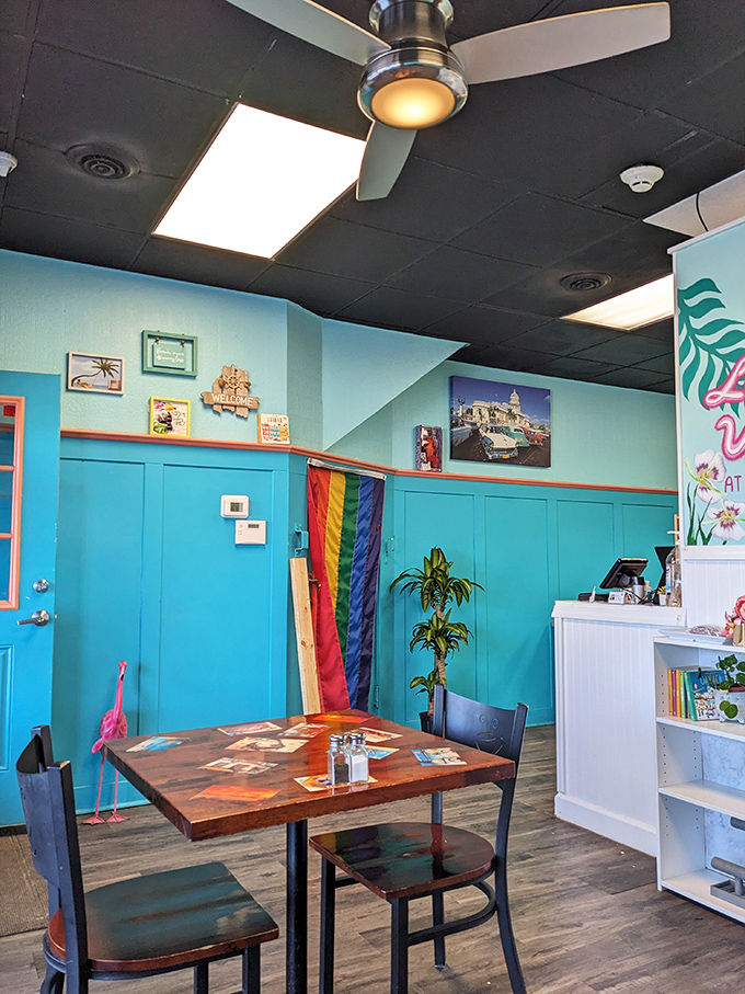 Step into this cozy corner of Cuba and let the cheery turquoise walls and rainbow flag welcome you to flavor paradise.