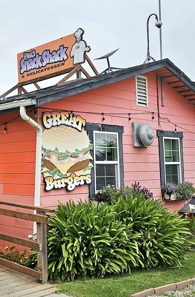 That chef on Phil's sign looks happier than a clam at high tide. Must be something in those burgers!