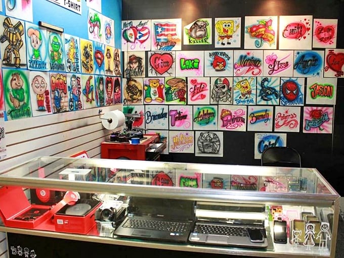 Pop art explosion! This booth is a riot of color and creativity, where SpongeBob rubs shoulders with superheroes in a carnival of custom artwork.