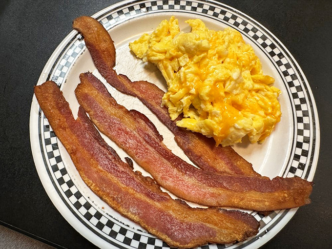 Bacon so crispy it could wake the dead, paired with eggs sunny enough to brighten even the gloomiest Monday.