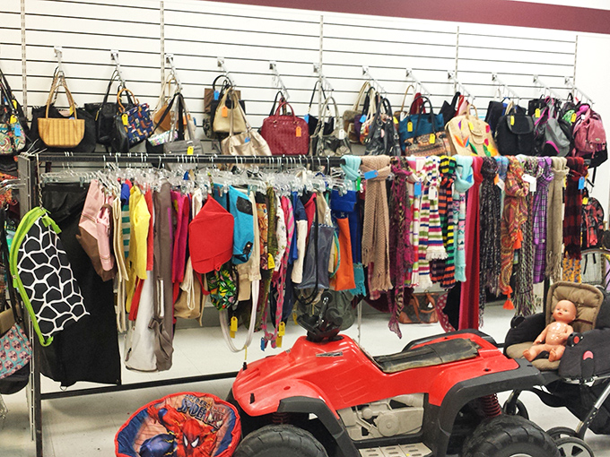 "Handbag heaven or purse purgatory?" A dizzying array of arm candy hangs in wait, from vintage clutches to modern totes.