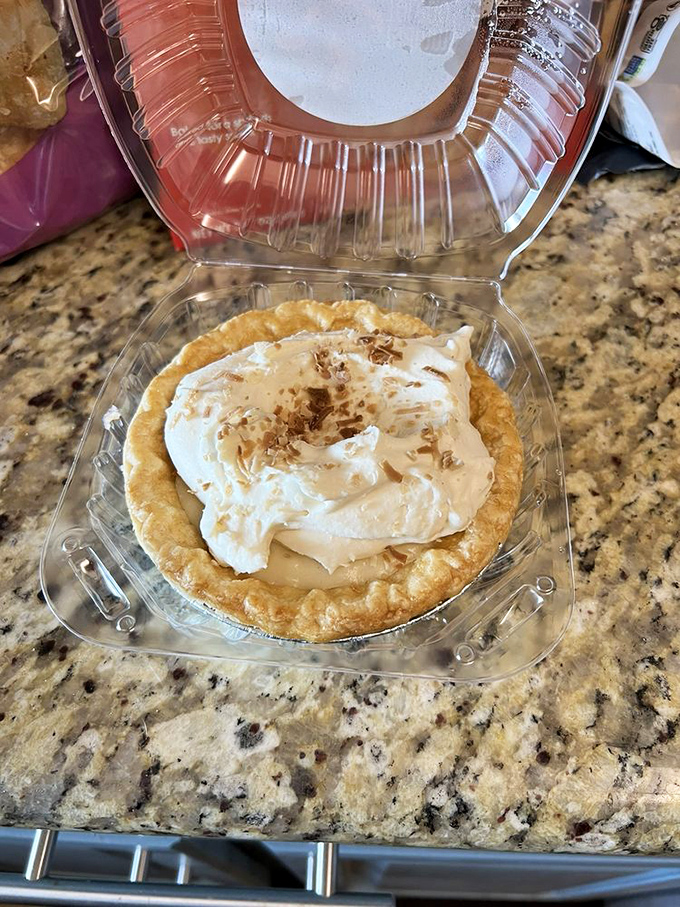 Cloud nine, meet plate. This coconut cream pie looks like it could float away if not anchored by its perfect crust.