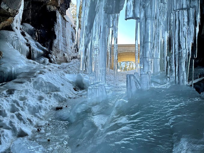 Frozen in time! This icy spectacle turns the tunnel into nature's own crystal palace. Watch your step, it's slippery!