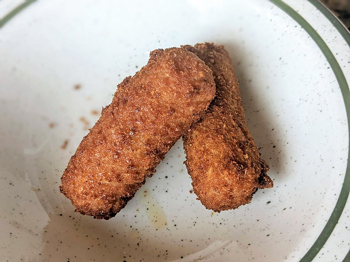 Croquetas de Jam&oacute;n: Crispy on the outside, creamy on the inside. These golden nuggets are the James Bond of appetizers - dangerously smooth.