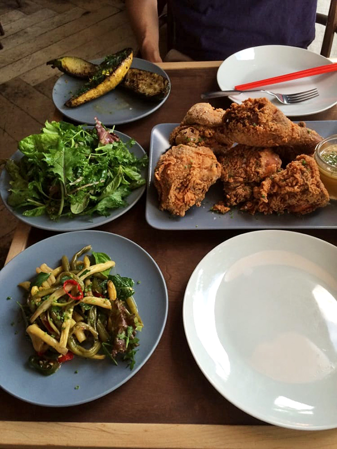 A feast fit for a comfort food king! Crispy chicken reigns supreme, while colorful sides play supporting roles in this mouthwatering spread.