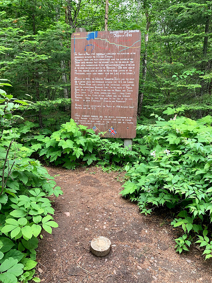 History carved in wood: This sign's got more stories than your grandpa after his third cup of coffee. Time for a history lesson, folks!