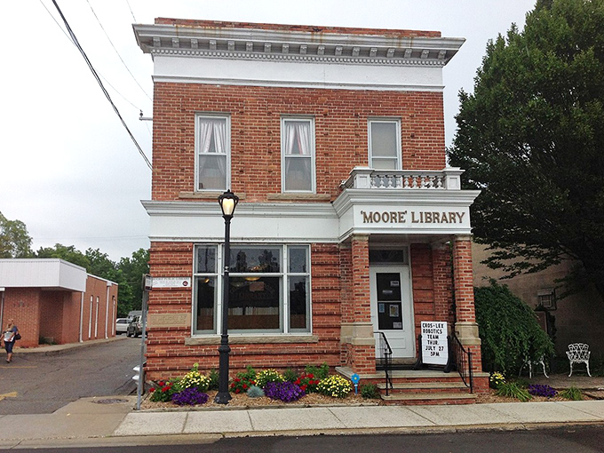 Shhh... Moore Library's quaint brick facade holds literary treasures and small-town stories. Time to judge this book by its lovely cover!