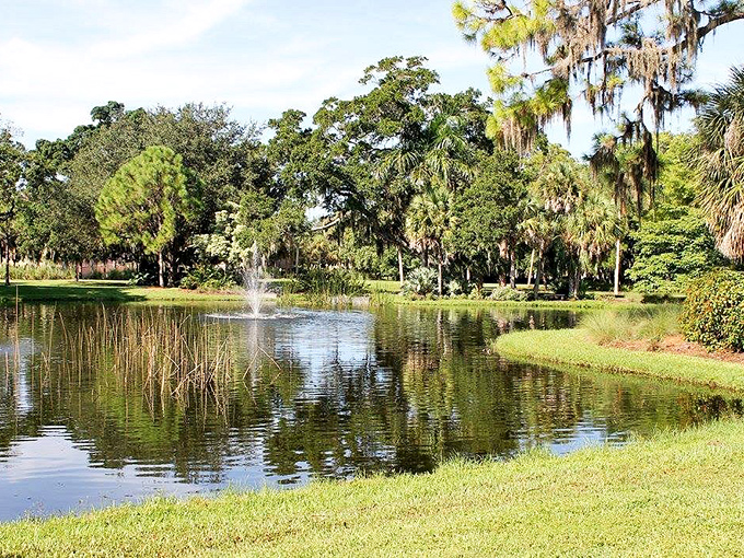 Who needs a moat when you've got this serene pond? It's giving major "secret garden meets Florida swamp chic" vibes.