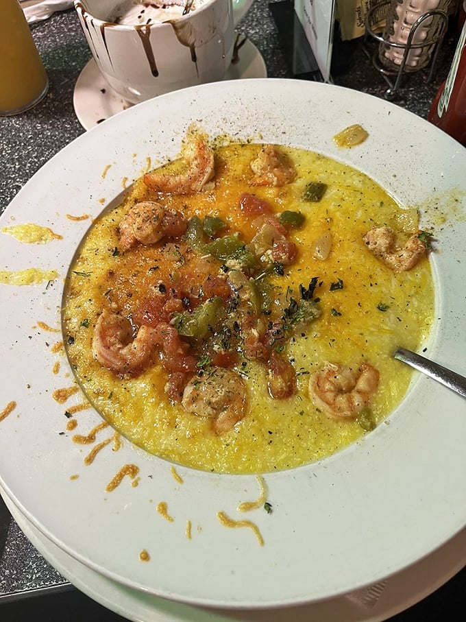 Shrimp and grits: where seafood meets soul food. It's like a warm hug from the ocean, with a Southern accent.