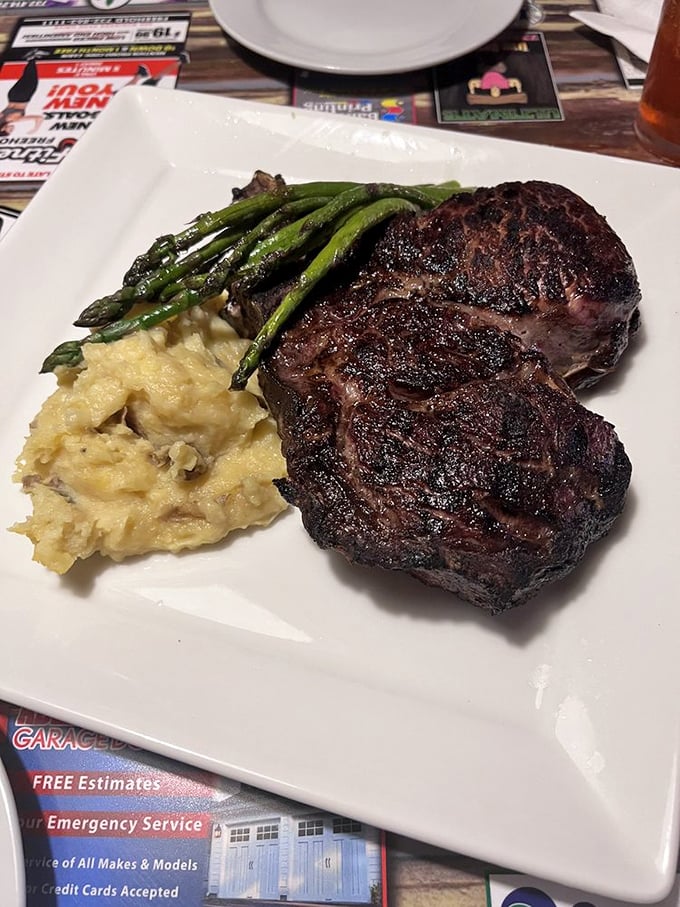 Steak and potatoes: the dynamic duo of comfort food. This plate is a testament to The Cabin's mastery of classic flavors, elevated to gourmet heights.