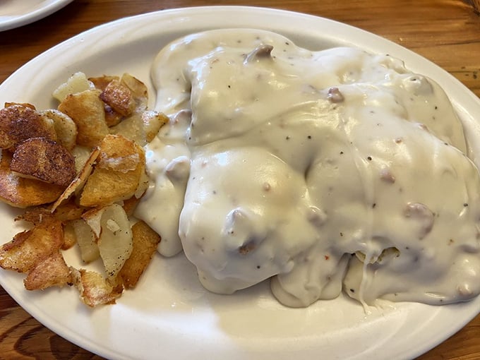 Biscuits and gravy: the breakfast of champions. This plate is comfort food incarnate, Southern hospitality on a dish.