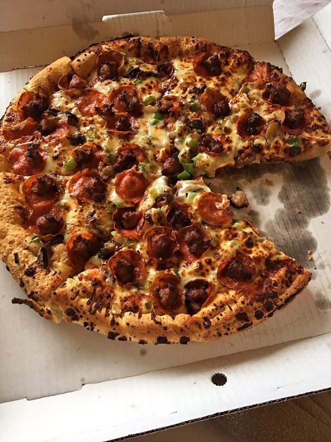 The Pizza Pub Special: Where every topping is the favorite child! This pie is so loaded, it might need its own zip code.