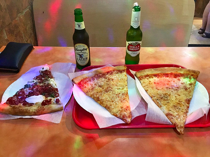 A tale of two pizzas: one's blushing with tomatoes, the other's gone full cheese. It's like Romeo and Juliet, but with a happier ending.