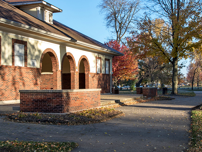 This charming structure stands ready to welcome visitors, like a cozy hobbit-hole for park enthusiasts.