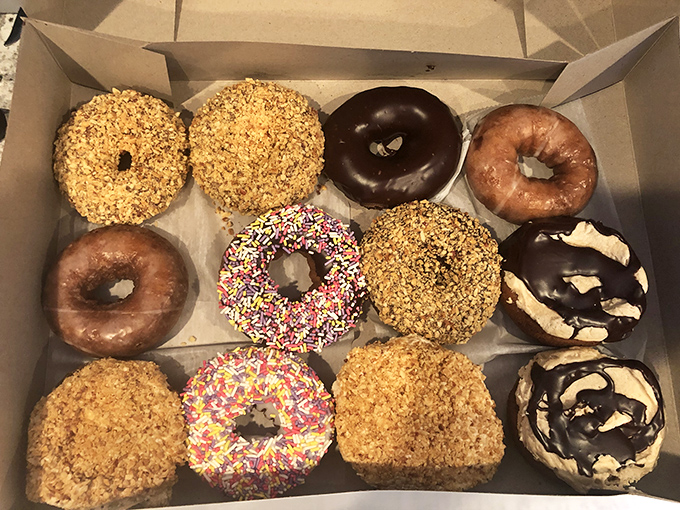 Donut heaven in a box! It's like someone shrunk down a carnival and filled it with fried dough happiness. Diets, beware!