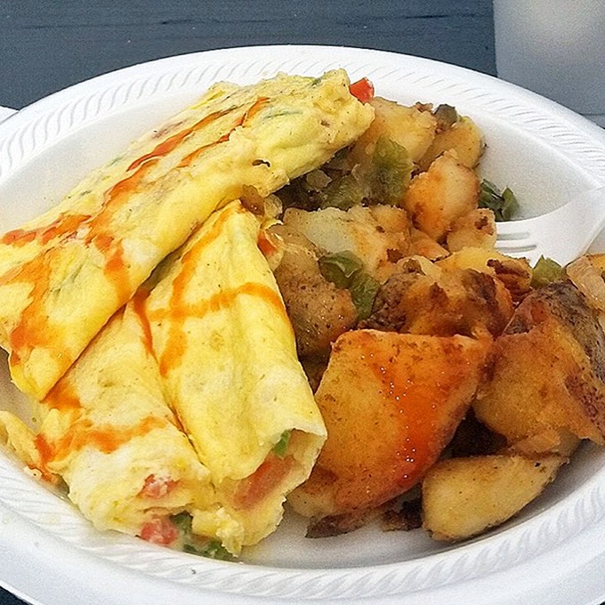 Breakfast of champions! This hearty plate is proof that the early bird gets the omelet - and the home fries, and the quesadilla too.