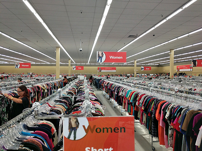 Welcome to the clothing forest! Rows of hangers stretch as far as the eye can see, each one a potential wardrobe game-changer. It's like playing dress-up, but for grown-ups.