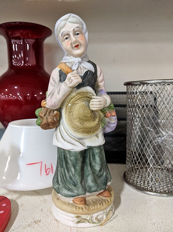 This figurine's expression says, "Yes, I've seen things." She's the guardian of the knick-knack section, judging your choices silently.