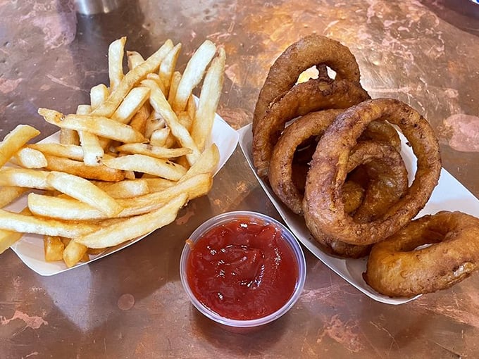 Golden treasures await! These crispy fries and onion rings are the Robin to your burger's Batman &ndash; a dynamic duo of deliciousness.
