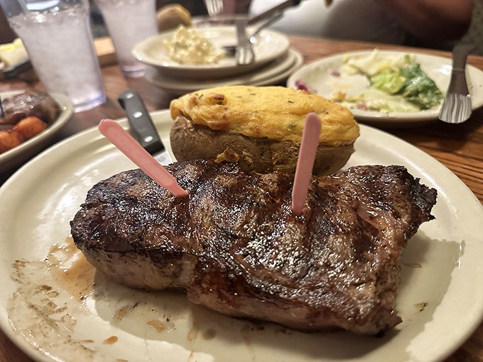 Behold the ribeye in its natural habitat, lounging next to a baked potato. It's the Midwest's answer to surf and turf.