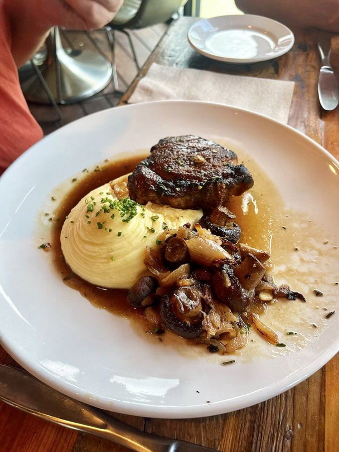 A steak so good, it might just bring a tear to your eye. This ribeye, nestled among caramelized onions and mushrooms, is the stuff of carnivorous dreams.