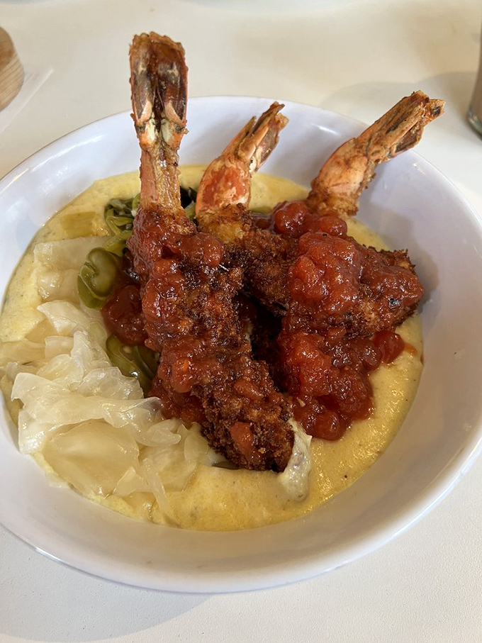 Shrimp and grits get a glow-up! These crustaceans are living their best life on a bed of creamy comfort. Southern charm meets Maine hospitality.